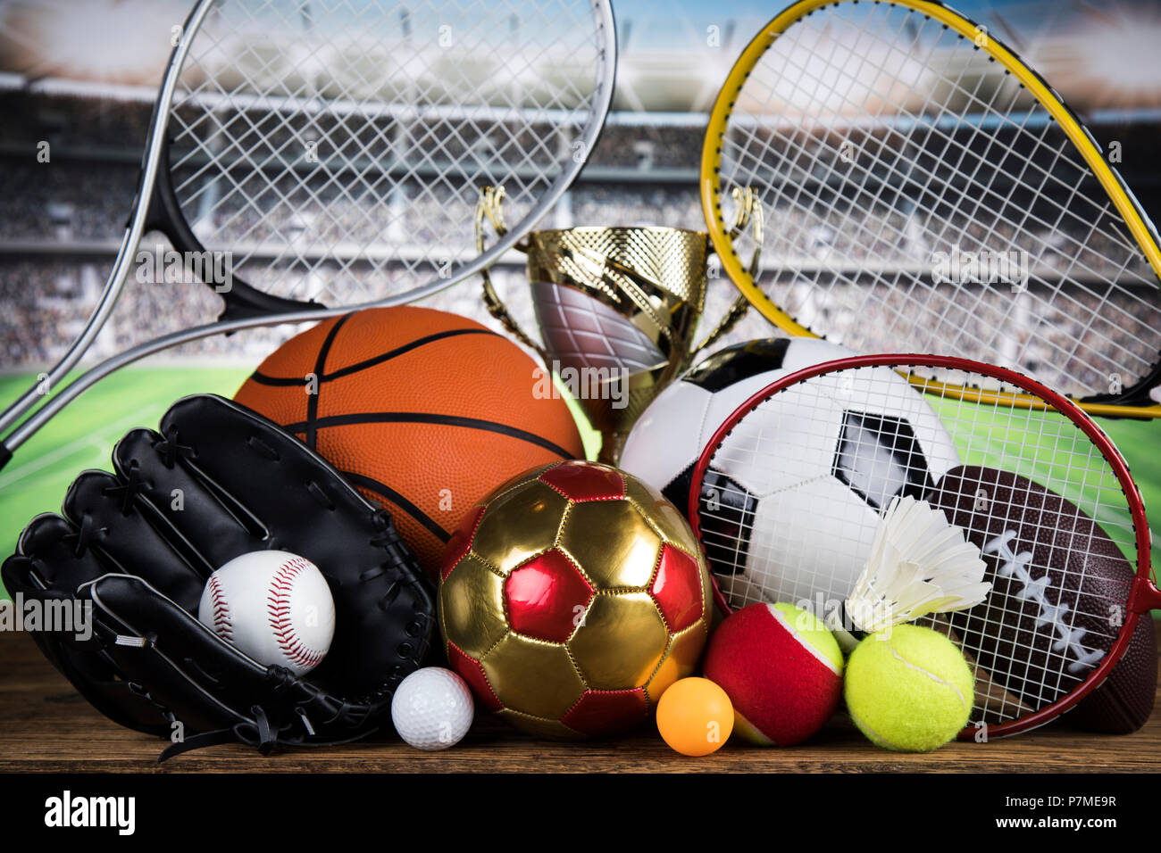 Cups of winners award, Sport equipment and balls Stock Photo - Alamy