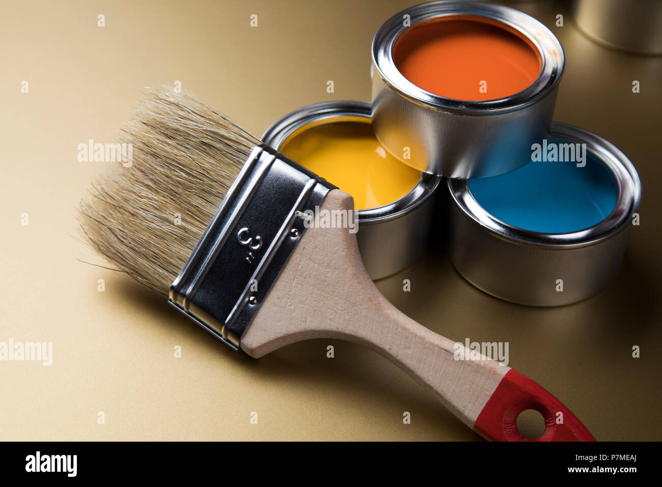 Metal tin cans with color paint and paintbrush Stock Photo - Alamy