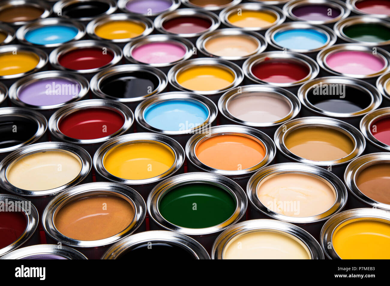 Group of tin metal cans with color paint Stock Photo - Alamy