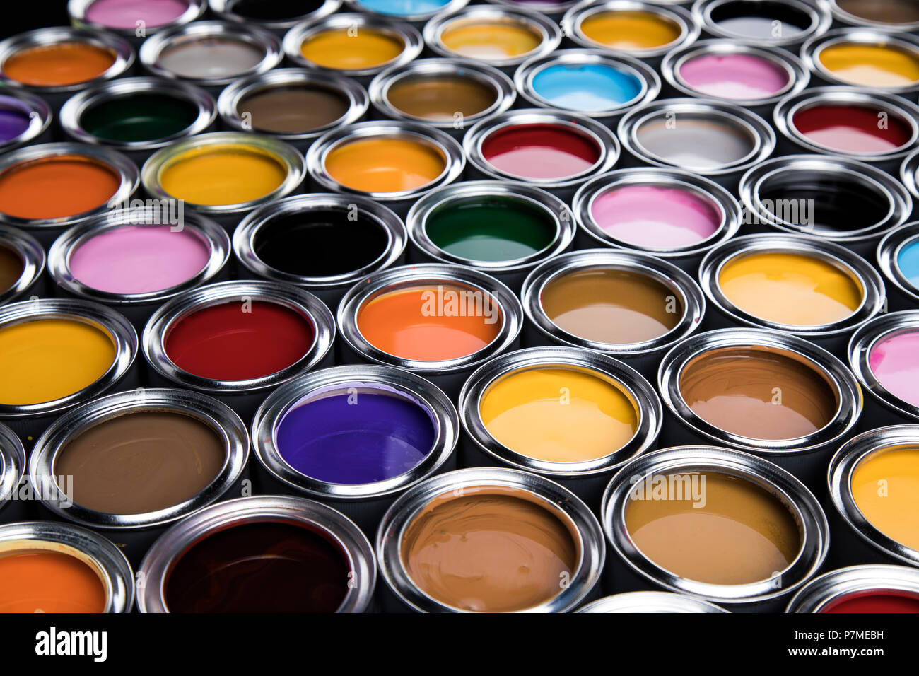 Group of tin metal cans with color paint Stock Photo - Alamy