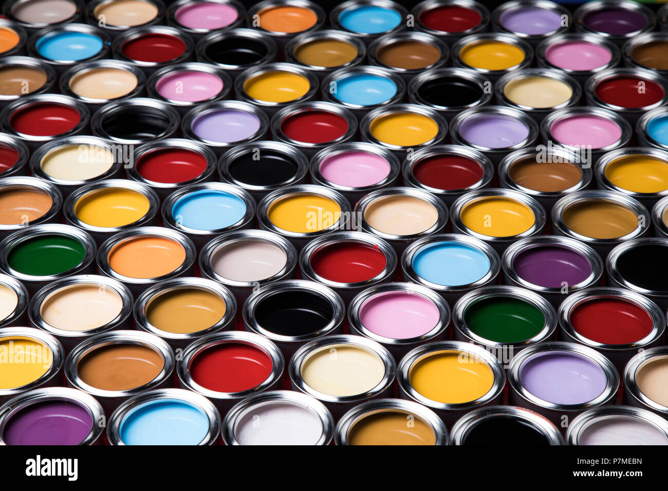 Group of tin metal cans with color paint Stock Photo - Alamy
