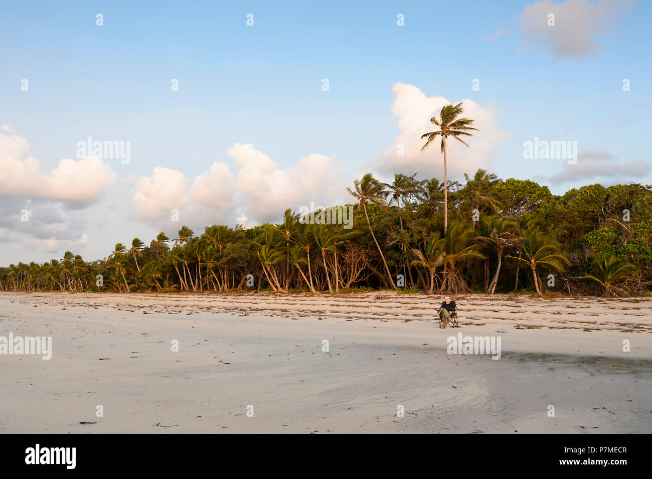 Adult male sitting on a chair at Chilli Beach, Cape York Peninsula, Far ...