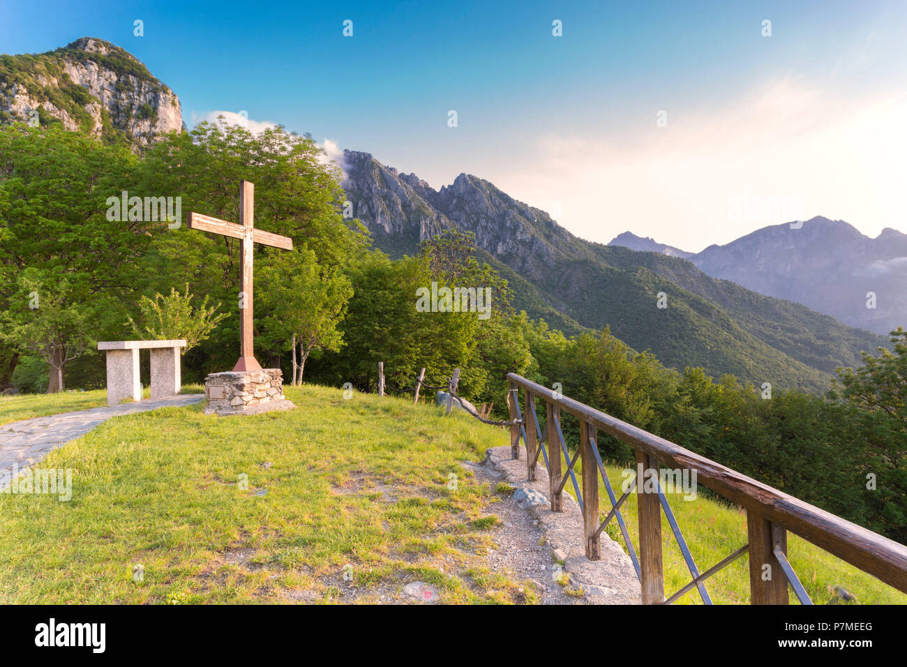The cross of San Tomaso at sunrise light, Valmadrera, Lecco Province ...