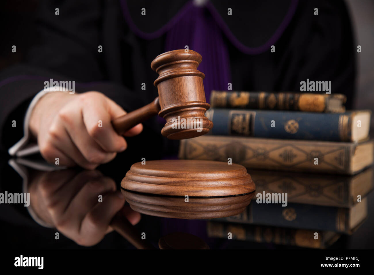 Judge, male judge in a courtroom striking the gavel Stock Photo - Alamy