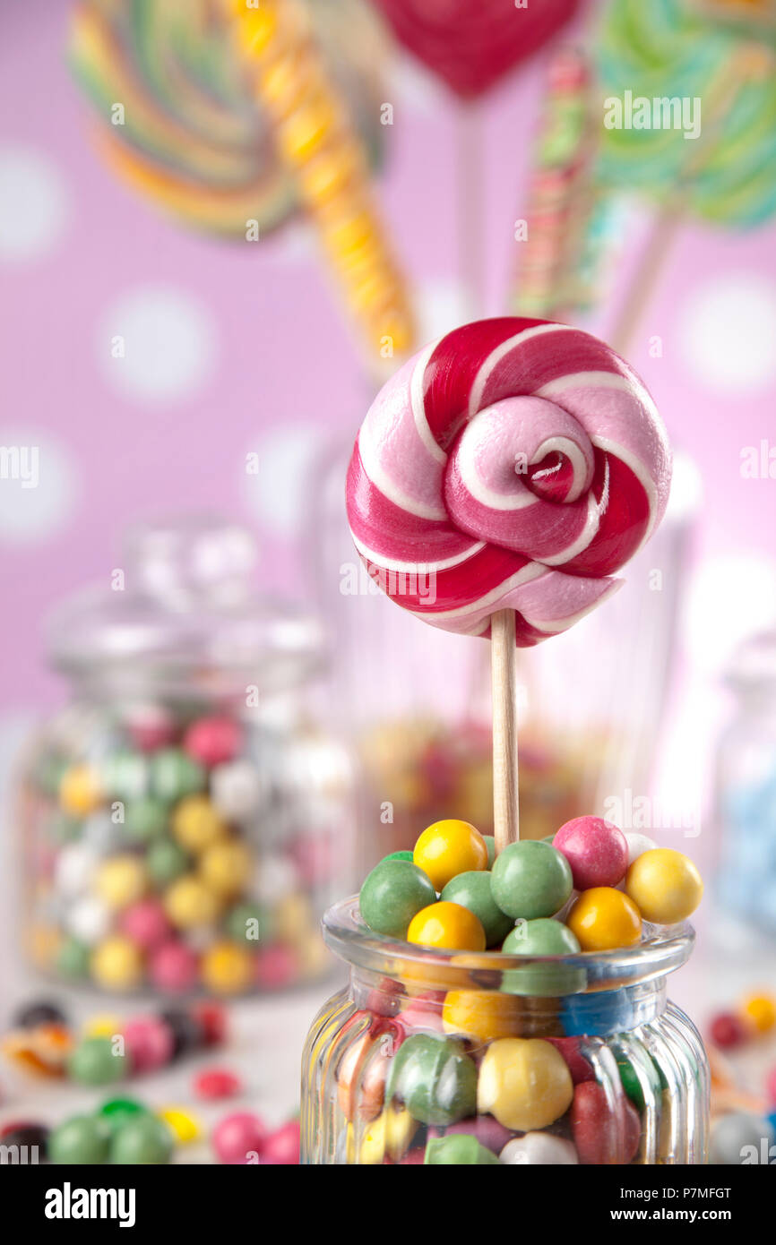 Glass jars in Colorful candies,lollipops and gum balls Stock Photo - Alamy
