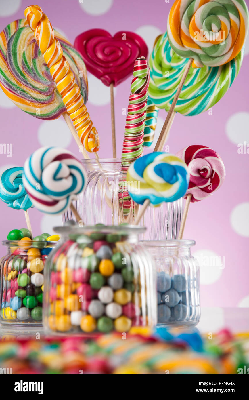 Glass jars in Colorful candies,lollipops and gum balls Stock Photo - Alamy