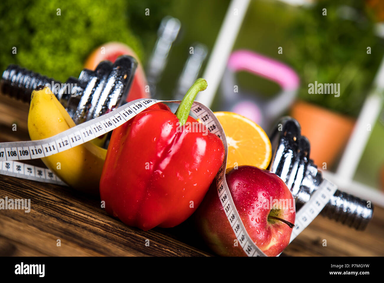 Vitamin and Fitness diet, dumbbell Stock Photo - Alamy