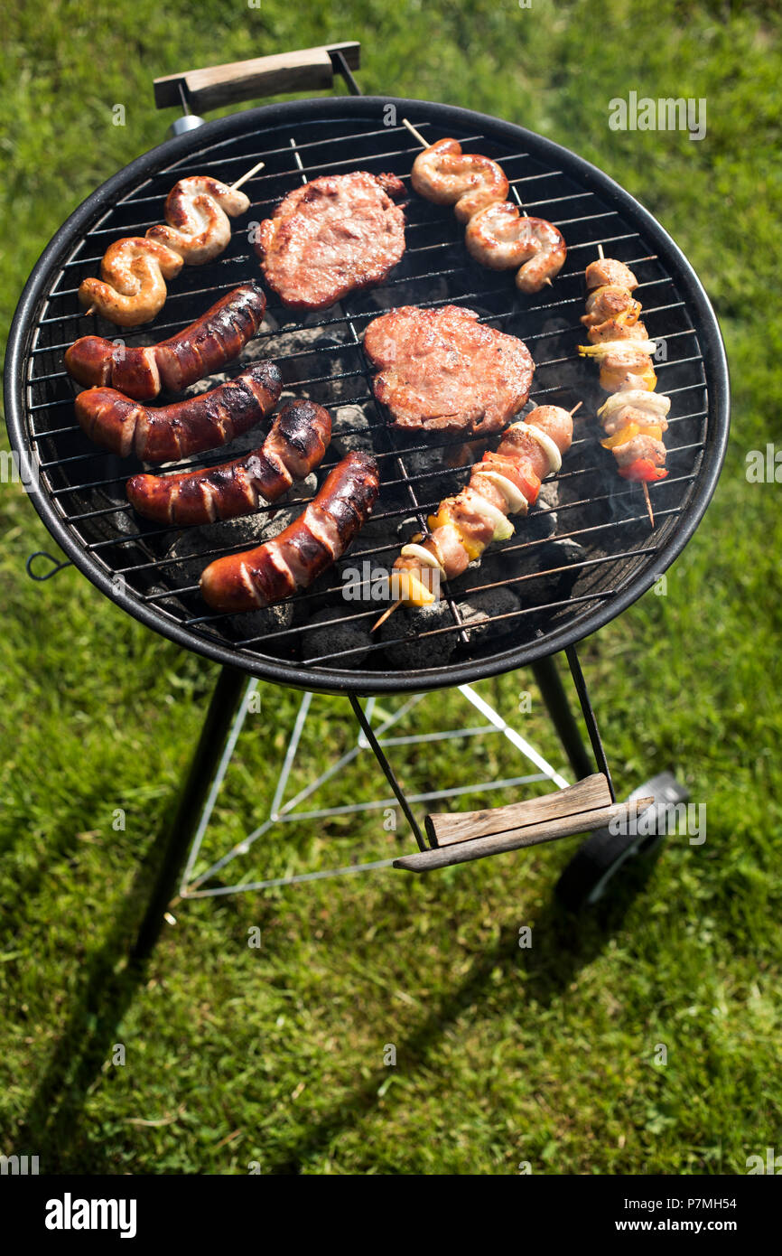 Assorted grilled meat on a summer barbecue, BBQ concept Stock Photo - Alamy