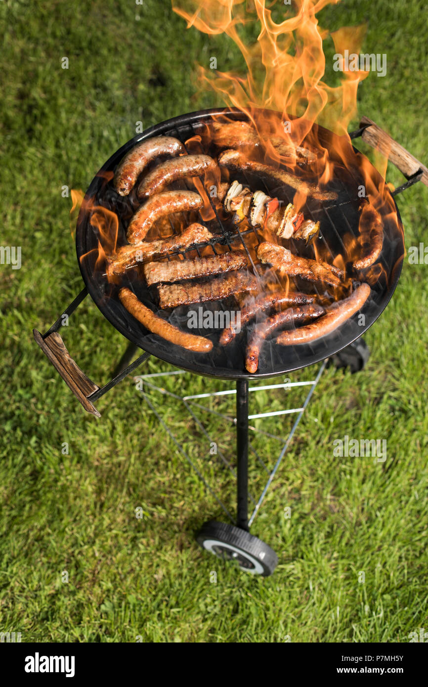 Grill with red hot briquettes, fire background Stock Photo - Alamy