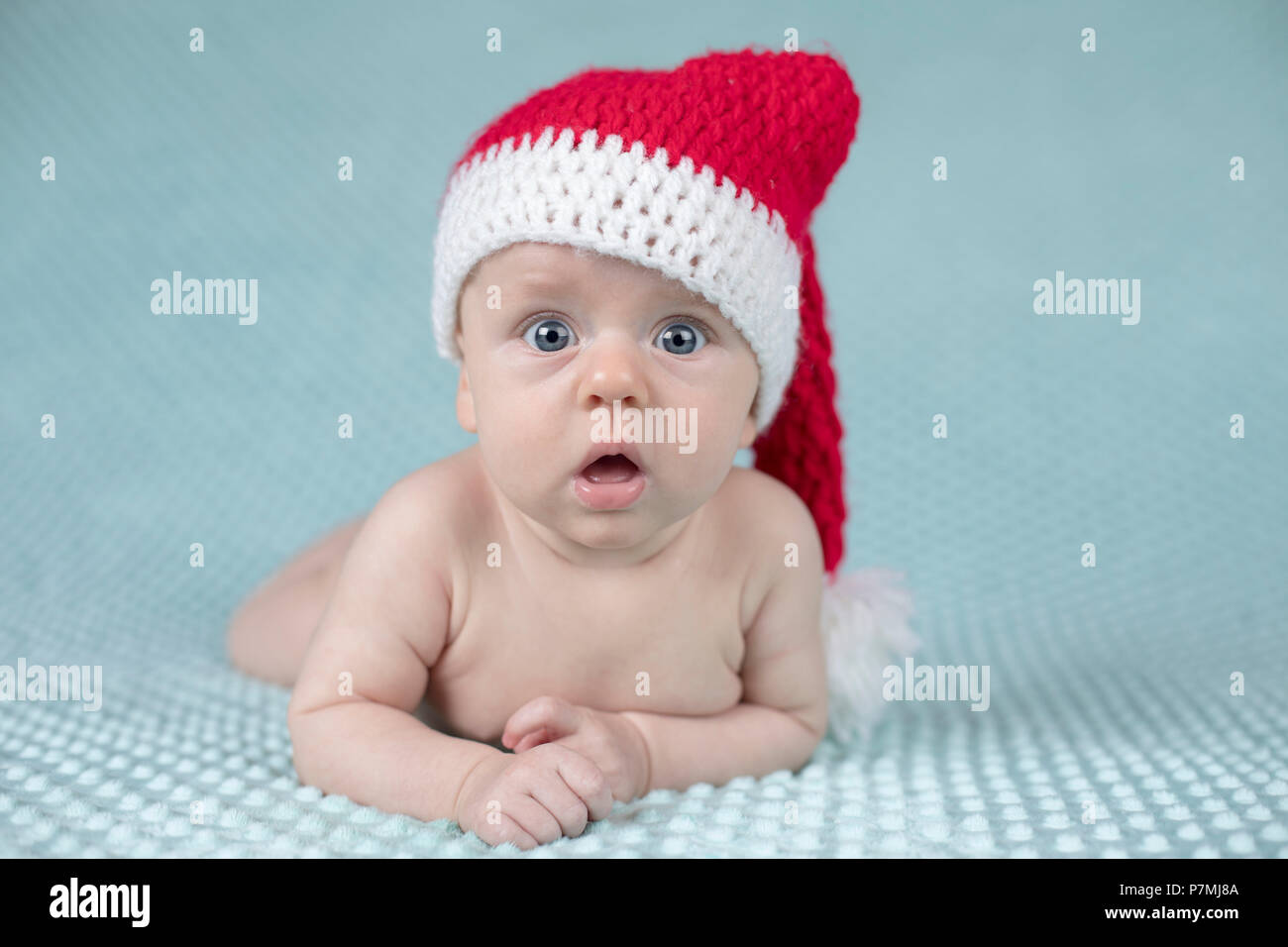 Baby in christmas hat Stock Photo - Alamy