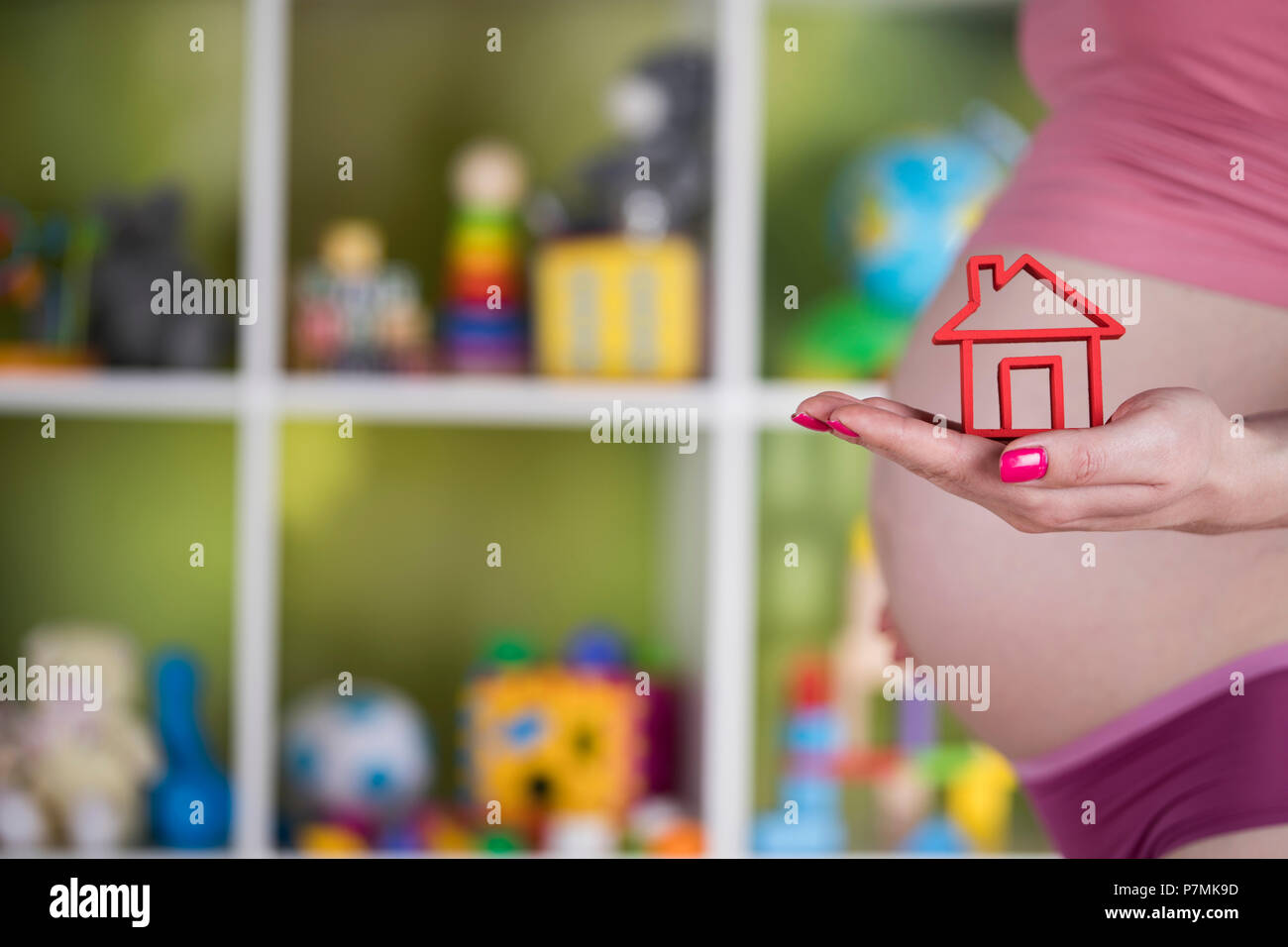 Pregnant house concept, of new home and family Stock Photo - Alamy