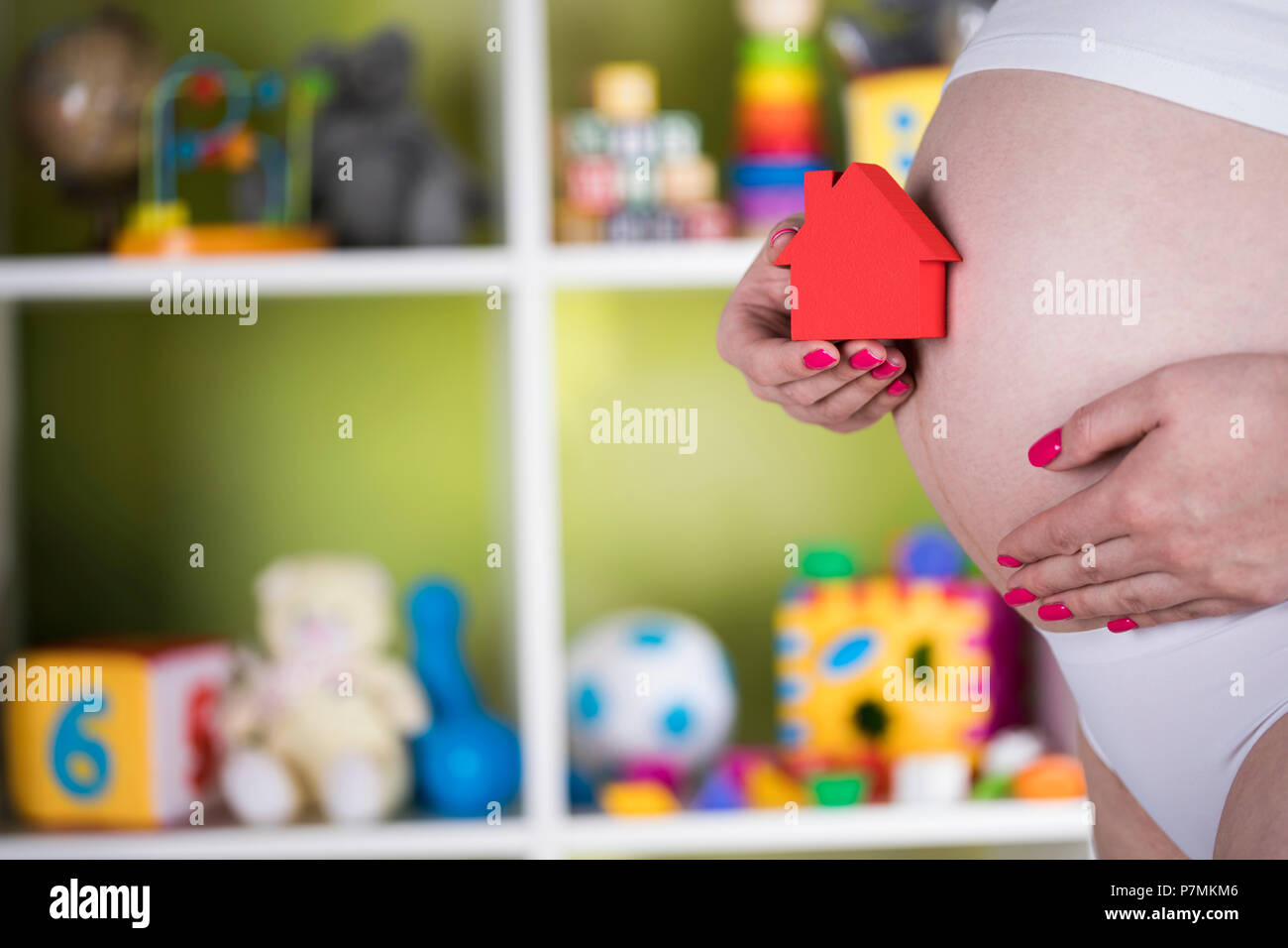 Pregnant house concept, of new home and family Stock Photo - Alamy