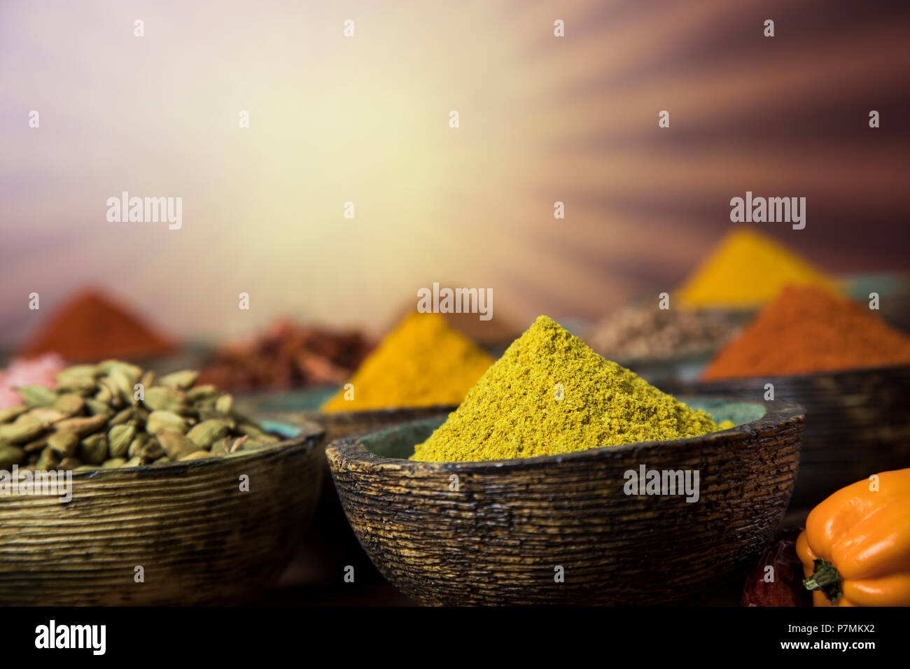 Wooden table of colorful spices Stock Photo - Alamy
