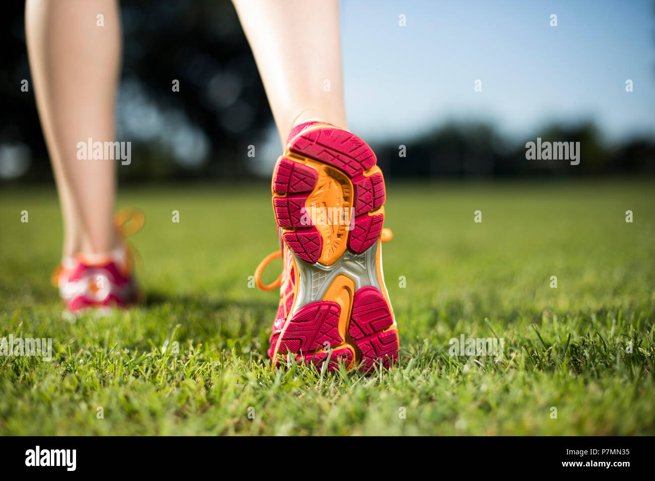 Runner feet running on road closeup on shoe Stock Photo - Alamy