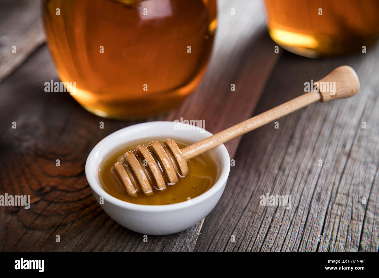 Jar of liquid honey Stock Photo - Alamy