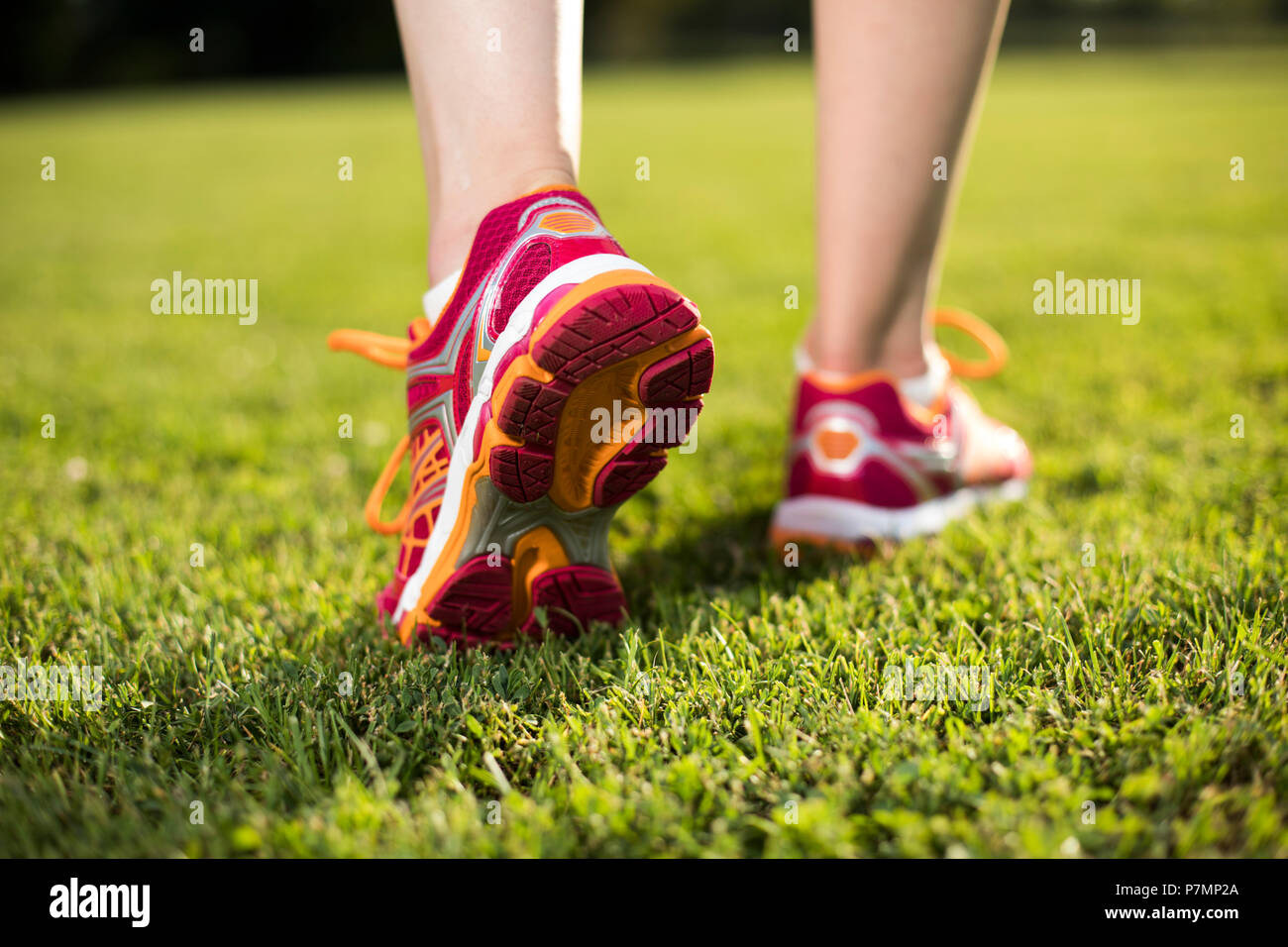 Runner feet running on road closeup on shoe Stock Photo - Alamy
