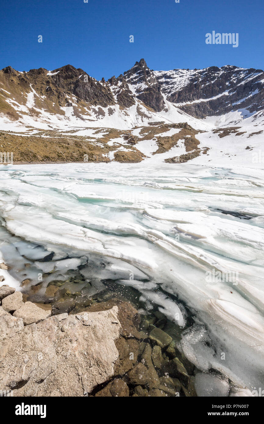 The snow begins to melt due to the spring thaw at Laj dal Teo Poschiavo ...