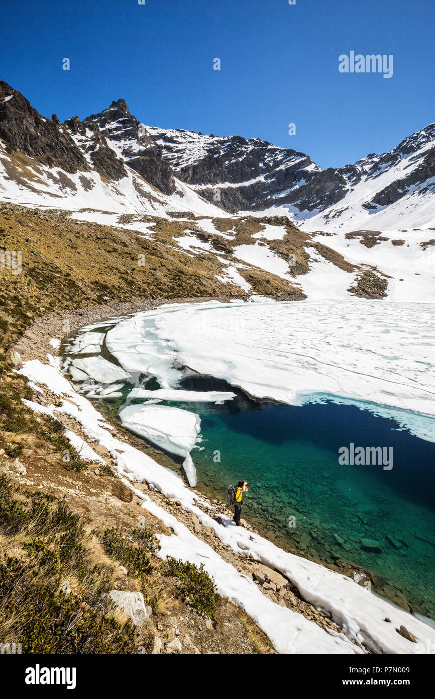 Photographer at Laj dal Teo where snow begins to melt due to spring ...