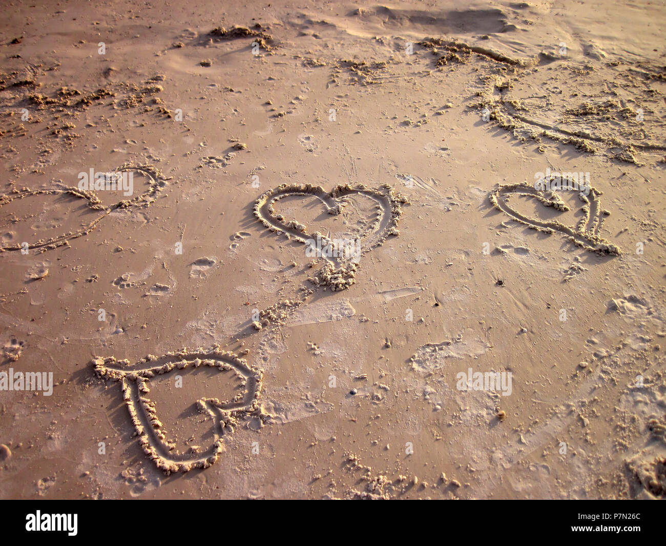 an image of heart shape drawing on the sand Stock Photo - Alamy