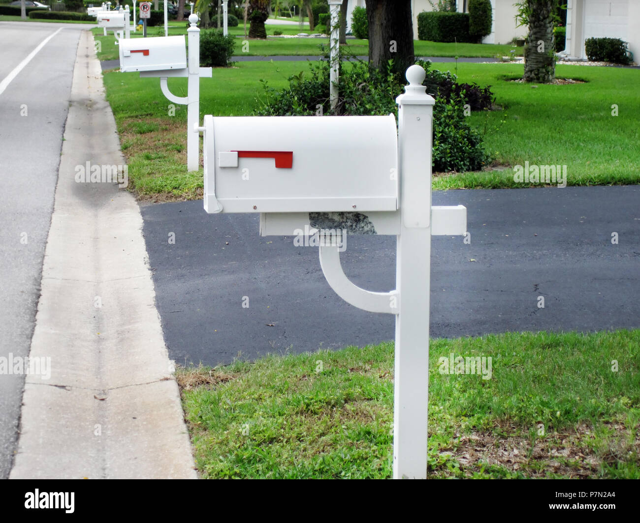 an image of white mailboxes in a row Stock Photo - Alamy
