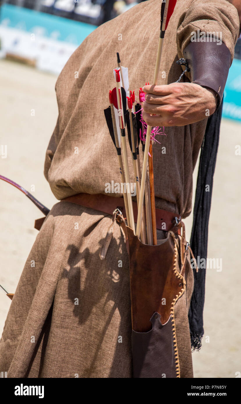 Arrow in hand as rprojectile weapon system archery Stock Photo - Alamy