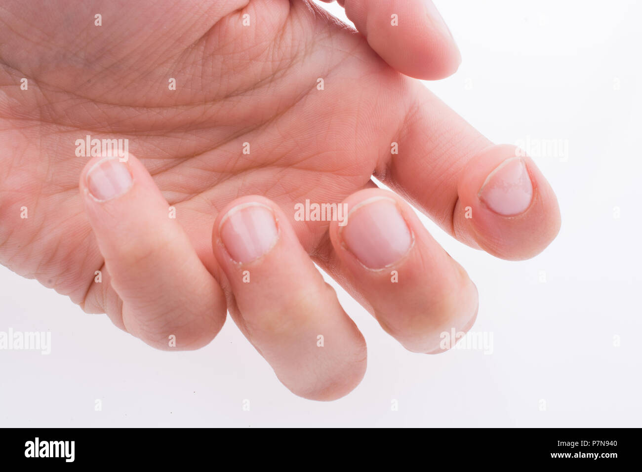 Hand showing its fingers and fingernails on a white background Stock ...