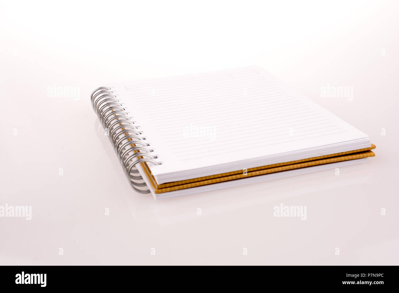 Spiral notebook on a white background Stock Photo - Alamy