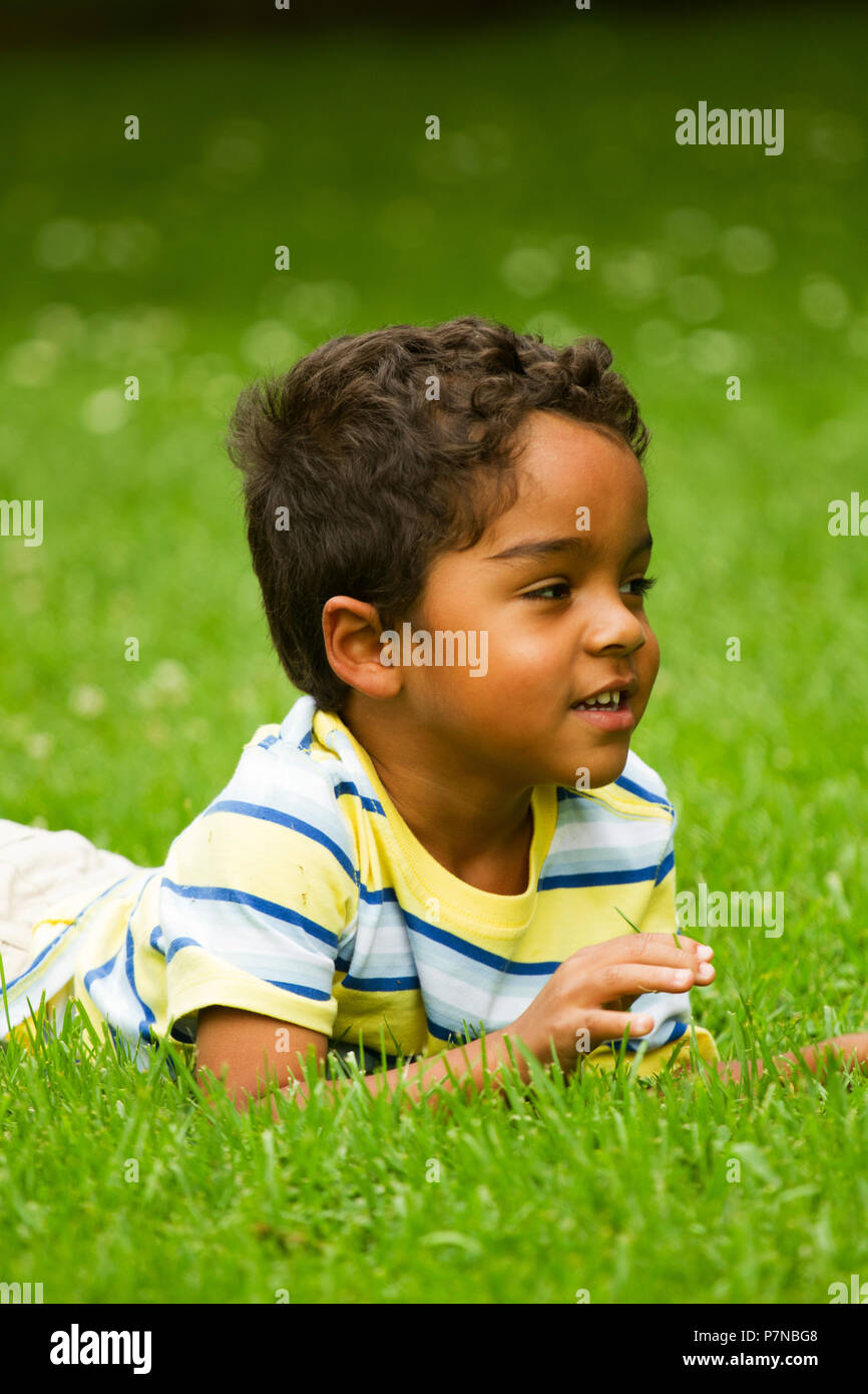Cute little hispanic boy smiling and outside playing Stock Photo - Alamy