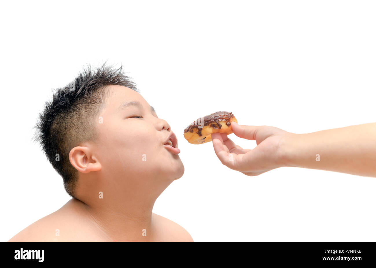 Obese fat boy is eating donut from mother hand isolated on white ...