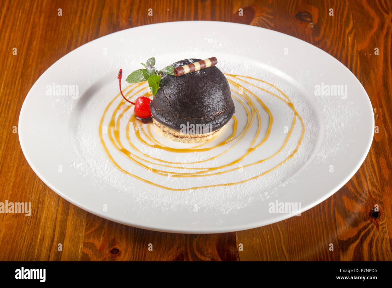 Chocolate cake with cherry and mint Stock Photo - Alamy