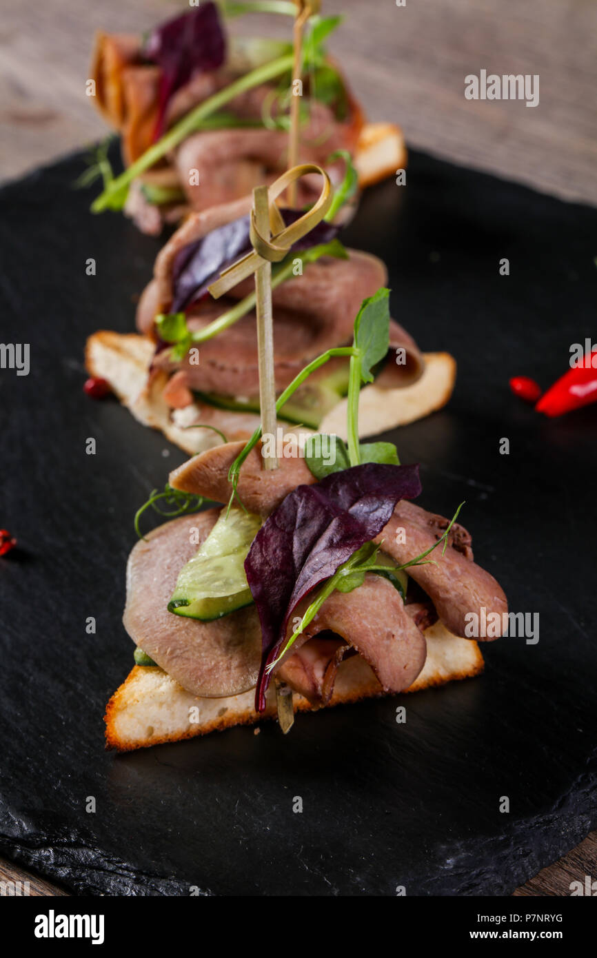 Beef canape served green onion Stock Photo - Alamy