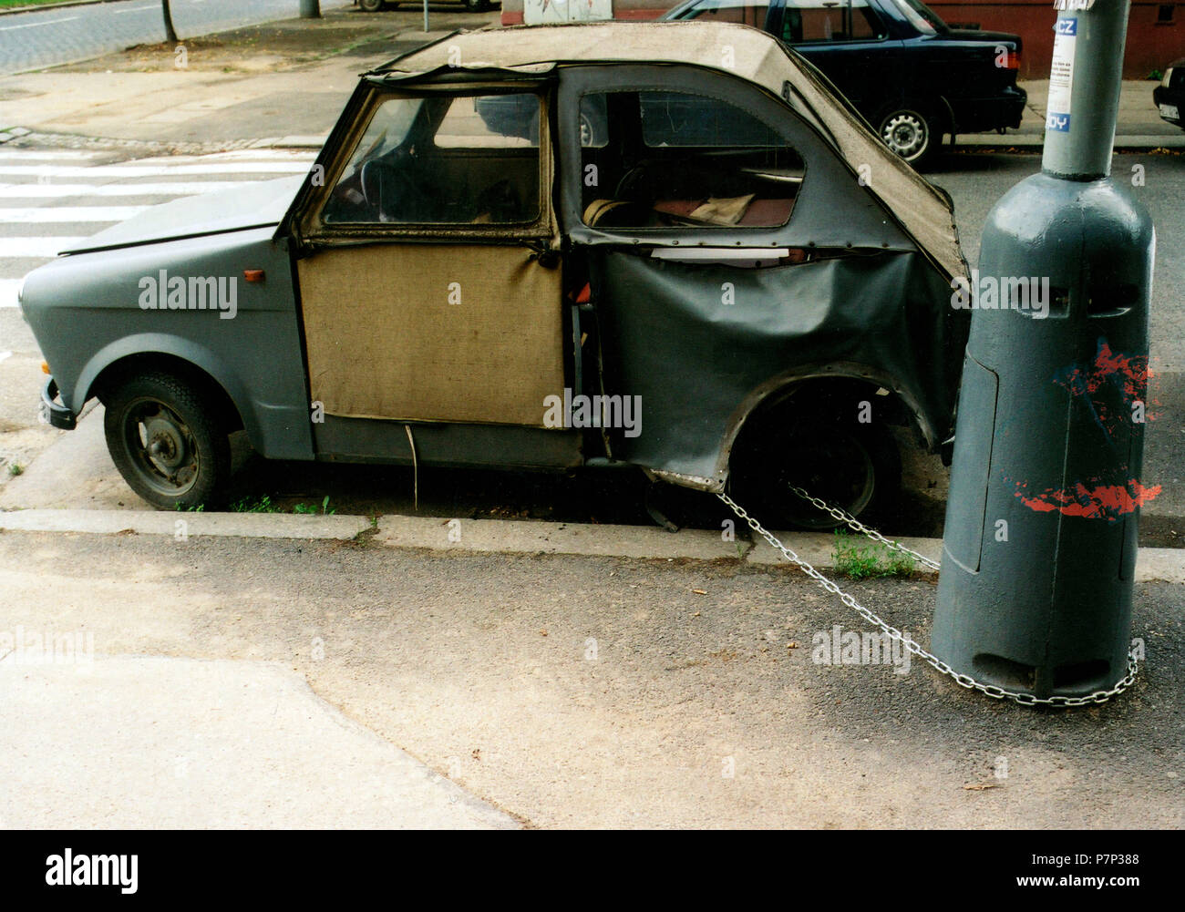 Broken car chained to a lamppost ca. 1970s, exact place unknown, Czech ...