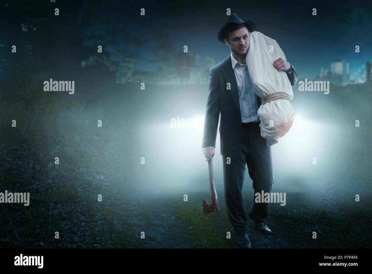 Murderer with an axe, serial maniac concept Stock Photo - Alamy