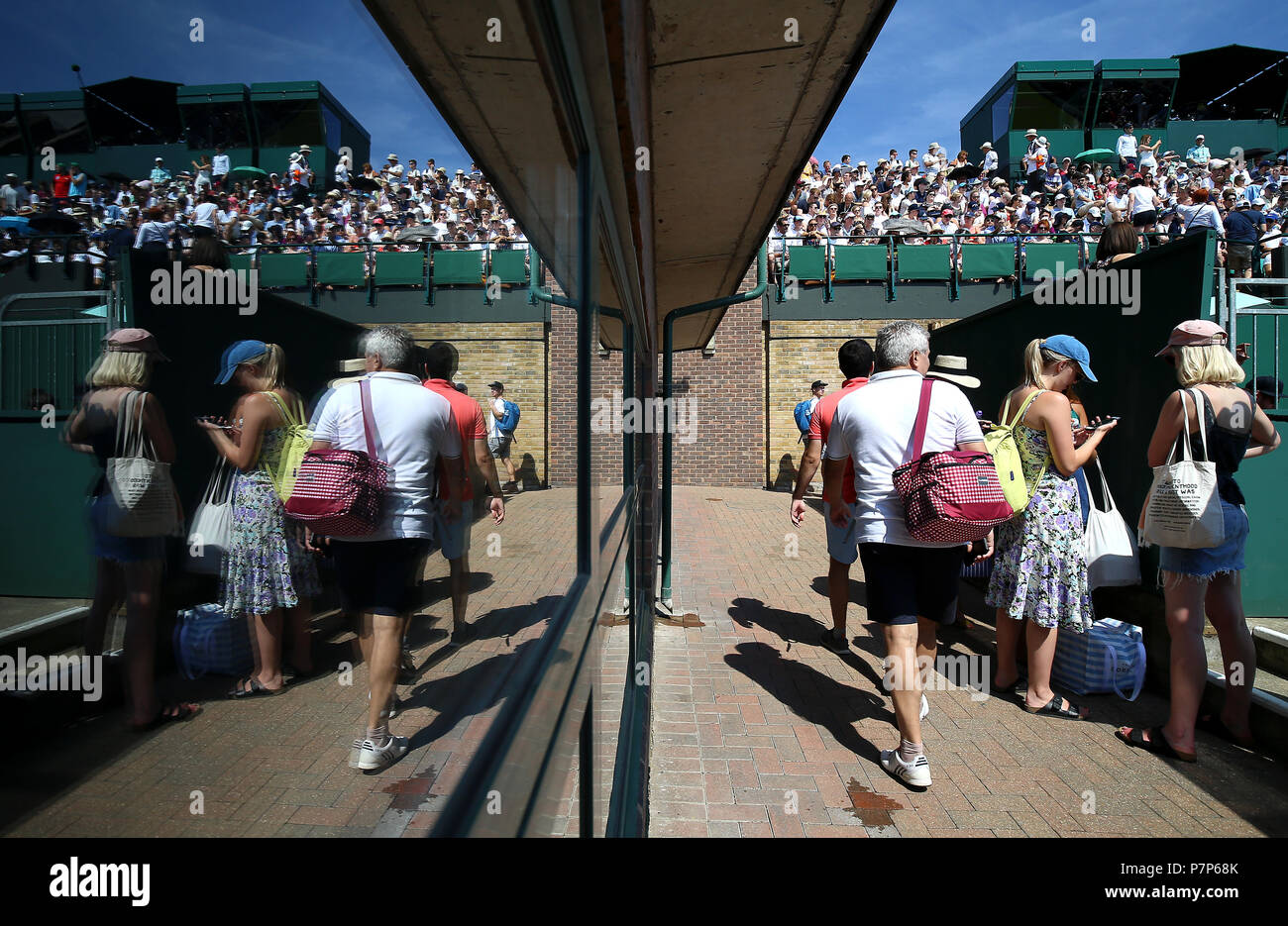 Spectators outside Court 18 on day six of the Wimbledon Championships ...