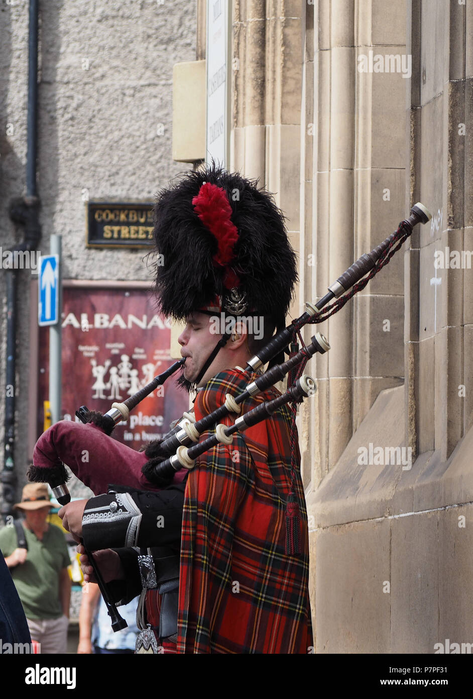 EDINBURGH, UK - CIRCA JUNE 2018: Bagpipe player busking on the Royal ...