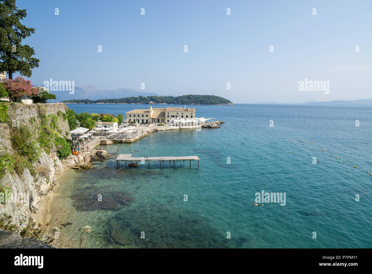 beautiful view over the beach in corfu, greece with really clear water ...