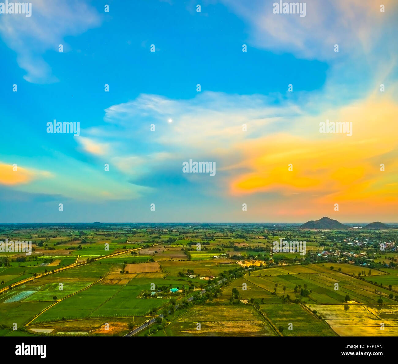 aerial view scenery sunset on new route pass in the rice field. under ...