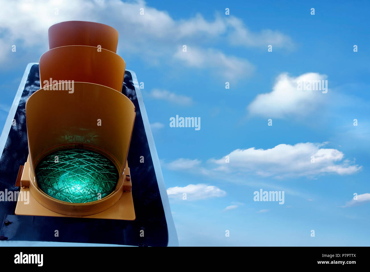 close up shot of traffic light on green Stock Photo - Alamy