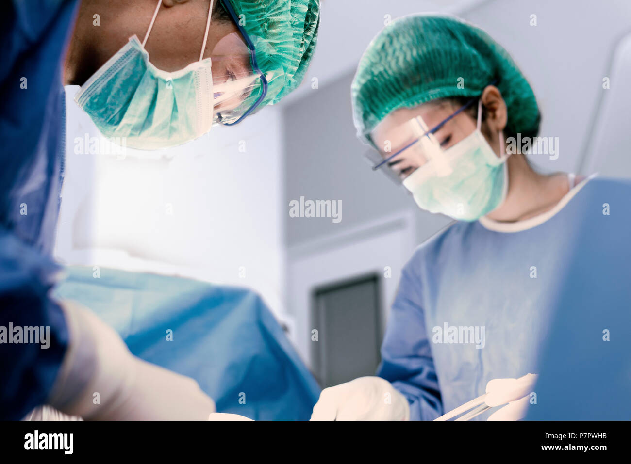 Doctors and nurse making surgery in operation room. Health care and ...
