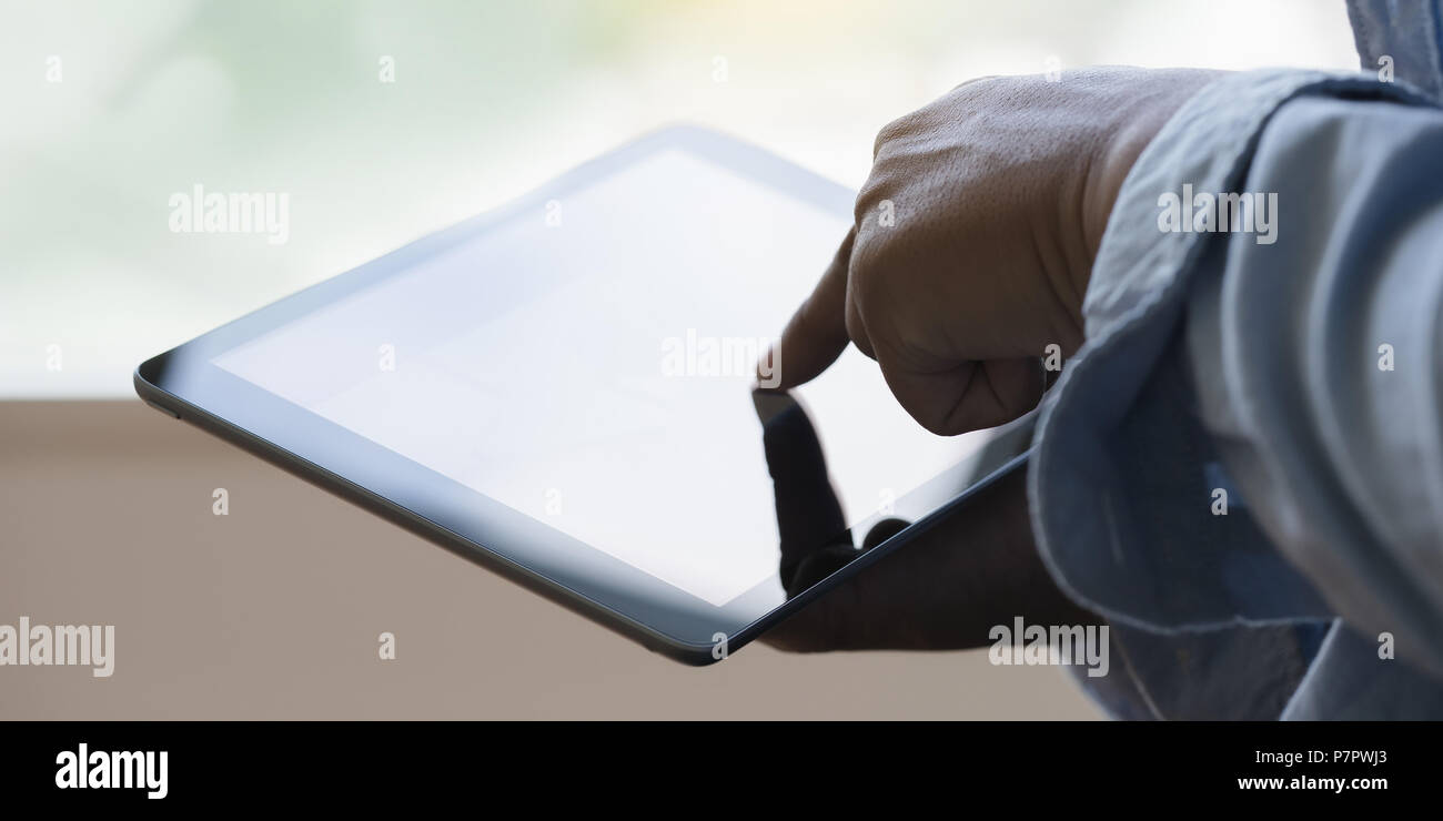 Digital tablet computer close up man using tablet hands man ...