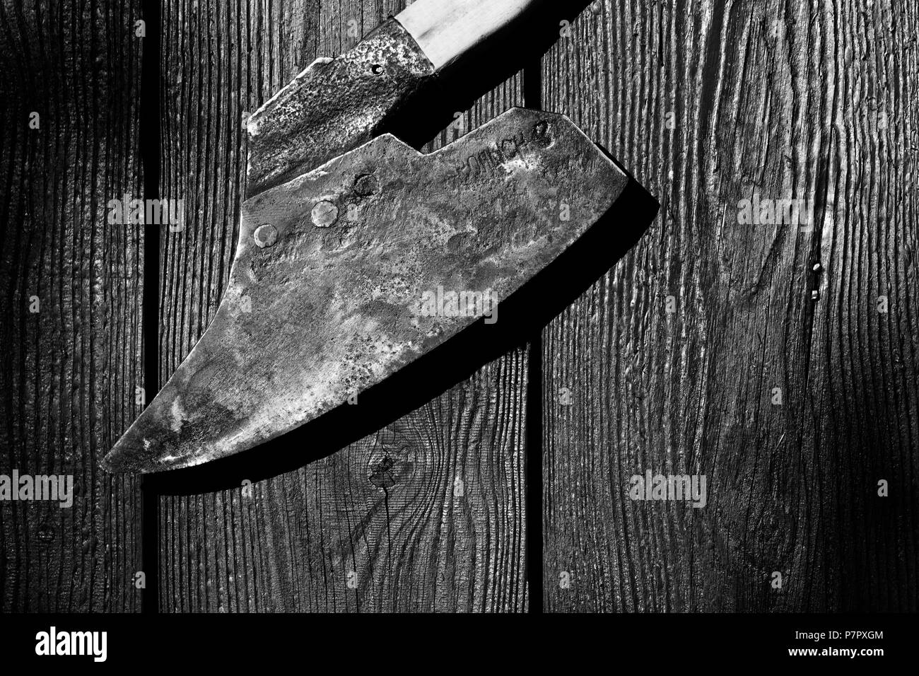 Old broad headed axe with wooden haft on wooden plank background Stock ...