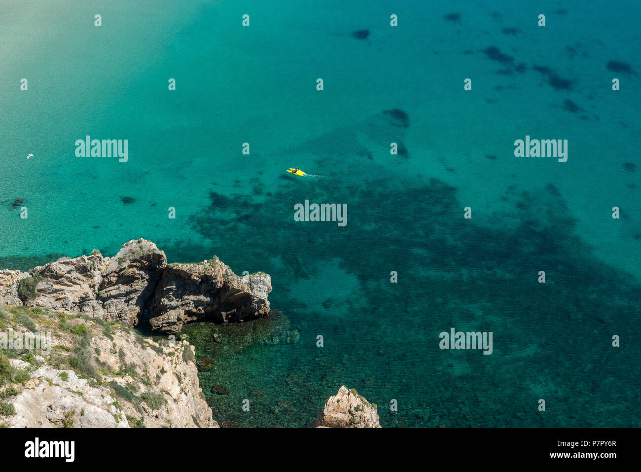 Aerial view of a pedal boat in the mediterranean sea, on the beach of ...
