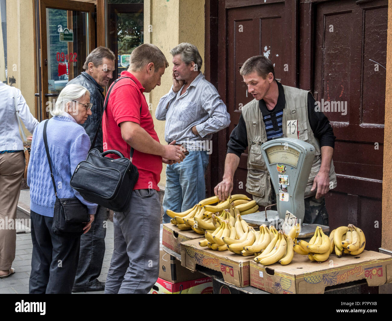 LVIV, UKRAINE - AUGUST 21, 2015: Banana seller on a stand on Lviv ...