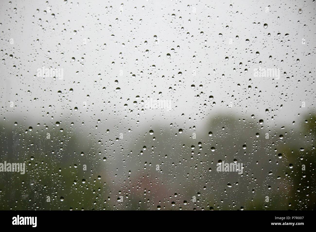 Drops of rain on window glass during storm Stock Photo - Alamy