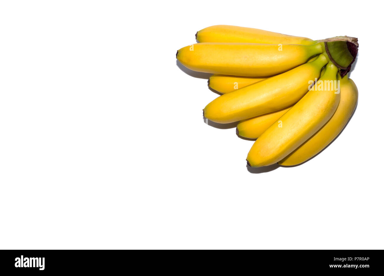 yellow ripe mini bananas isolated on white background. object, fruit ...