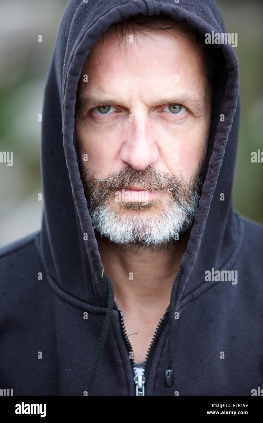 Man wearing a hood hi-res stock photography and images - Alamy