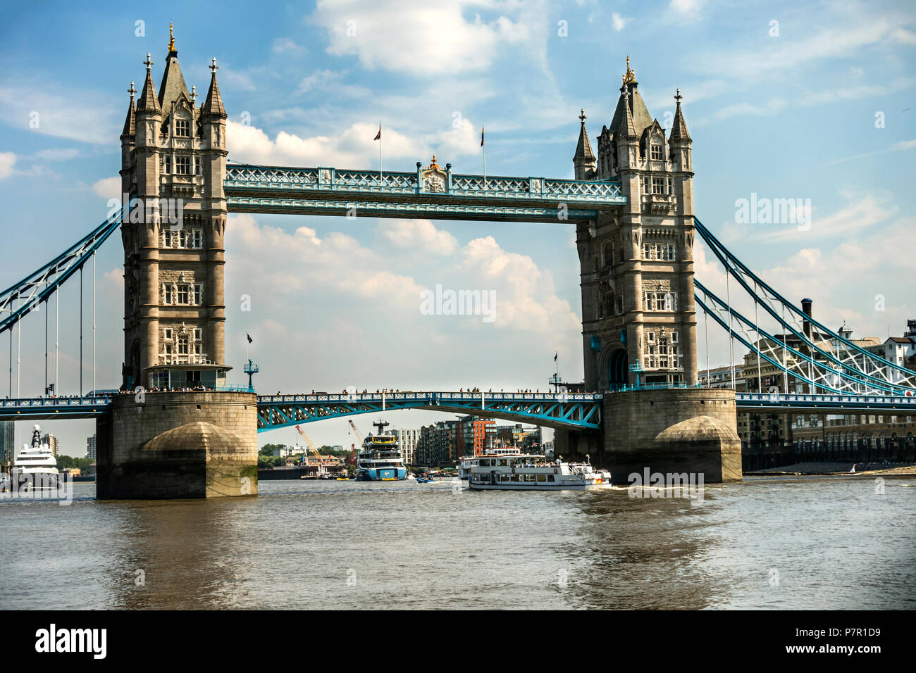 Tower Bridge over the River Thames in London, England. People ...