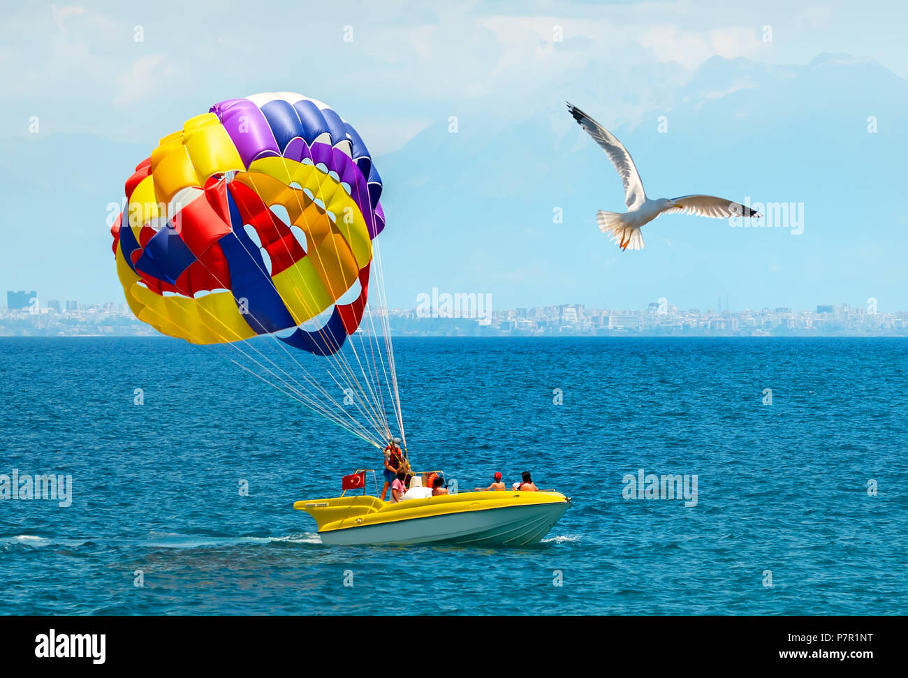 People flying with parachute over sea in Turkey Stock Photo - Alamy