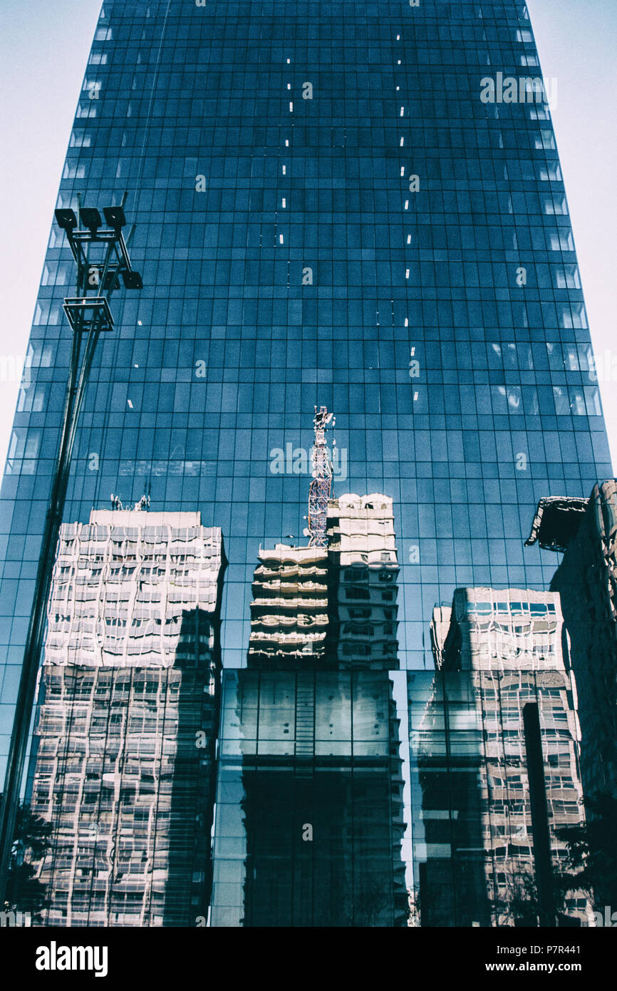 Tall corporate tower made of glass windows Stock Photo - Alamy