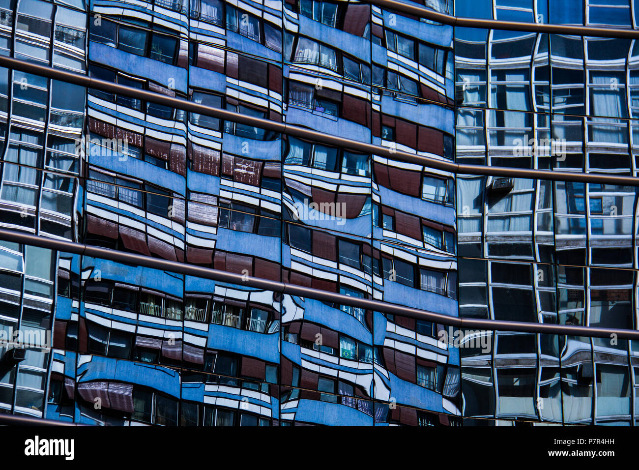 Detail of the reflection of a residential building on a shopping mall ...